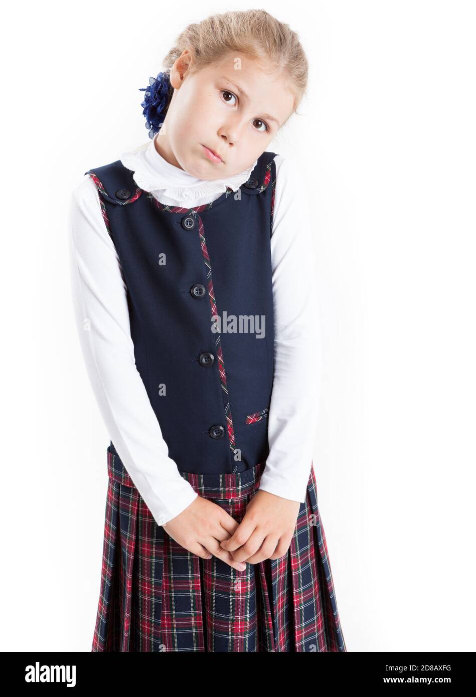 Portrait of sad primary school girl dressed school uniform, isolated on ...