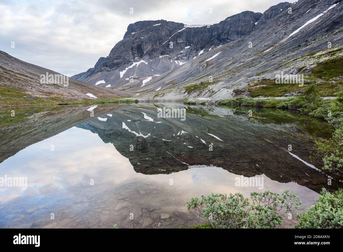 Calm surface of mountain lake with reflection, Khibins mountains in ...