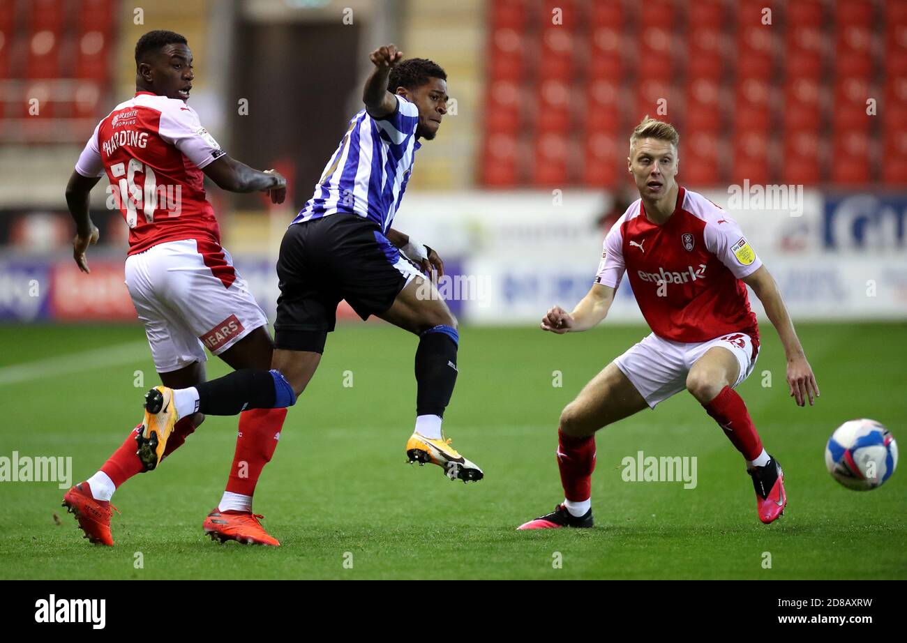 Sheffield Wednesday's Kadeem Harris (centre) battles for the ball with ...