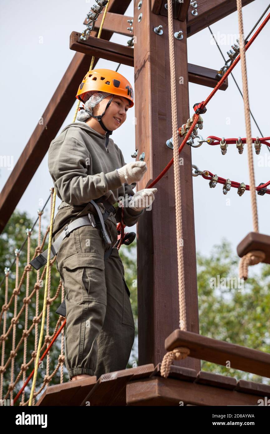 Teenager climbing a tree hi-res stock photography and images - Alamy