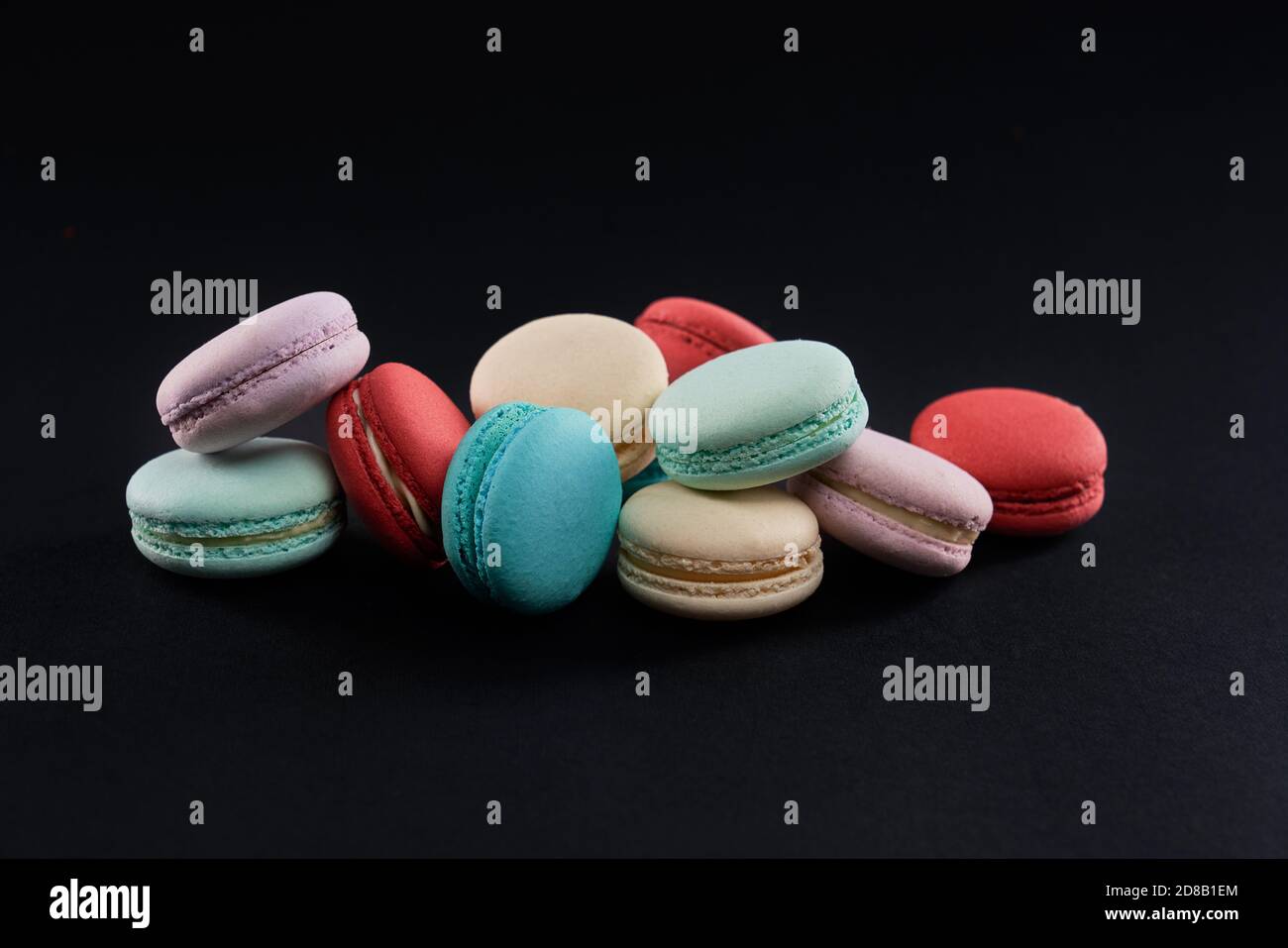 Front closeup view of colorful macaroon cookies with differest tastes ...