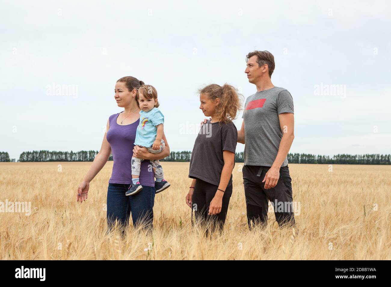Four people family side view portrait, father, mother, teen age girl ...