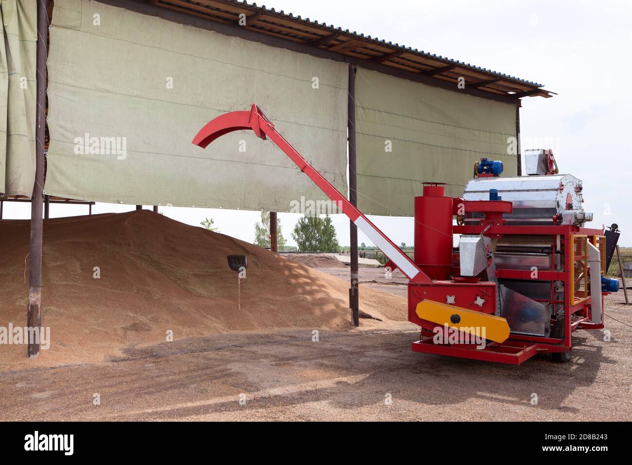 Roofed outdoor warehouse, a shed for storing grain crops, conveyor ...