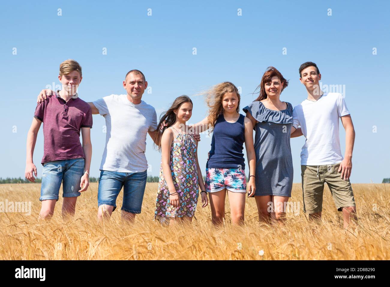 Parents with many minor children, long family portrait embracing ...