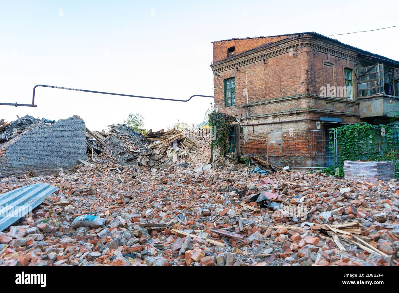 Dismantled building. A mountain of bricks. Destruction of buildings ...