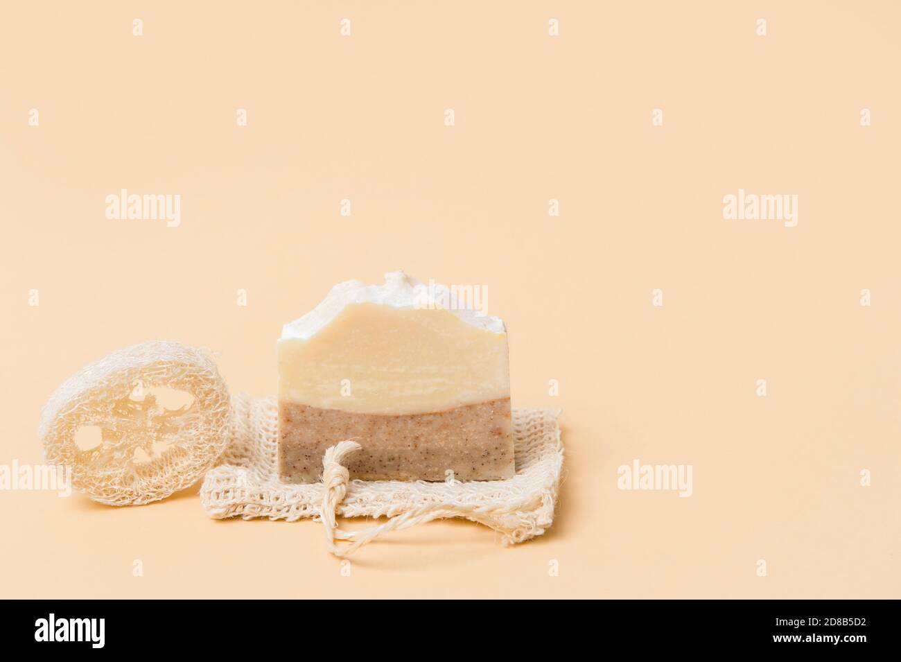 Handmade soap and loofah sponges on a beige background. Eco lifestyle ...