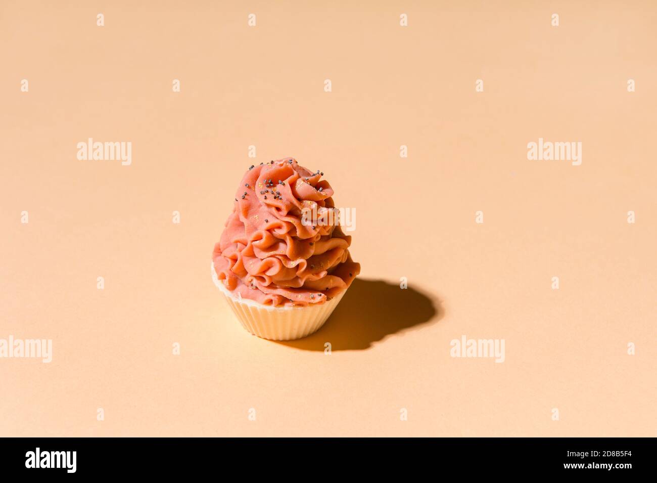 Natural handmade soap, cupcake with cream on cream color background ...