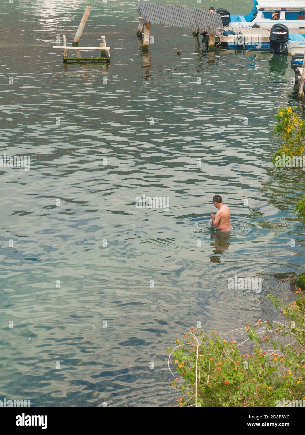 Man bathing in Lake Atitlan Stock Photo - Alamy