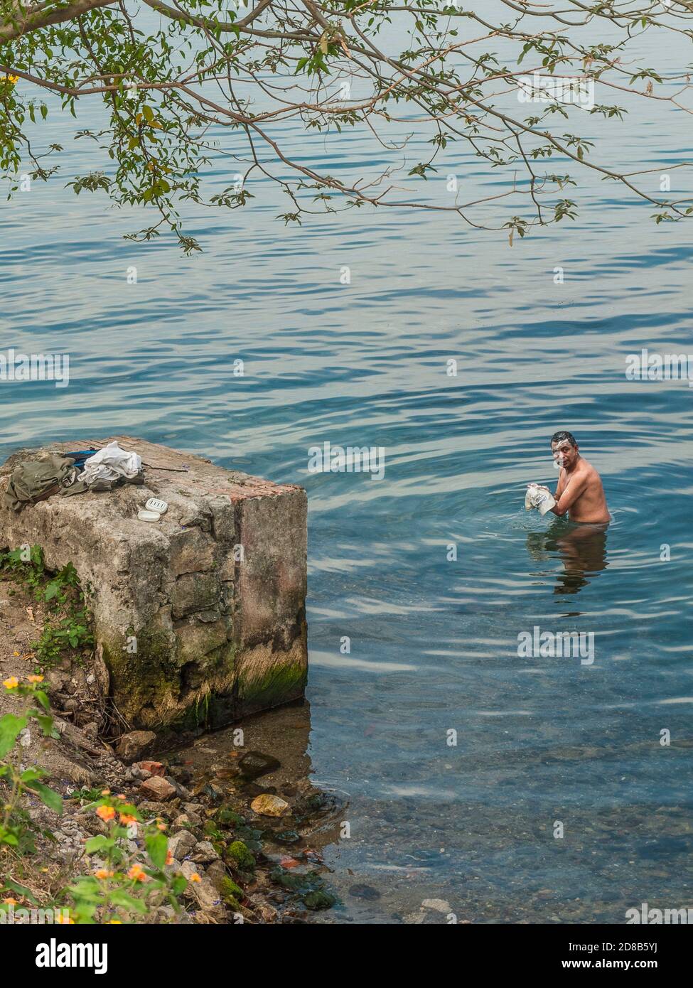 Man bathing in Lake Atitlan Stock Photo - Alamy