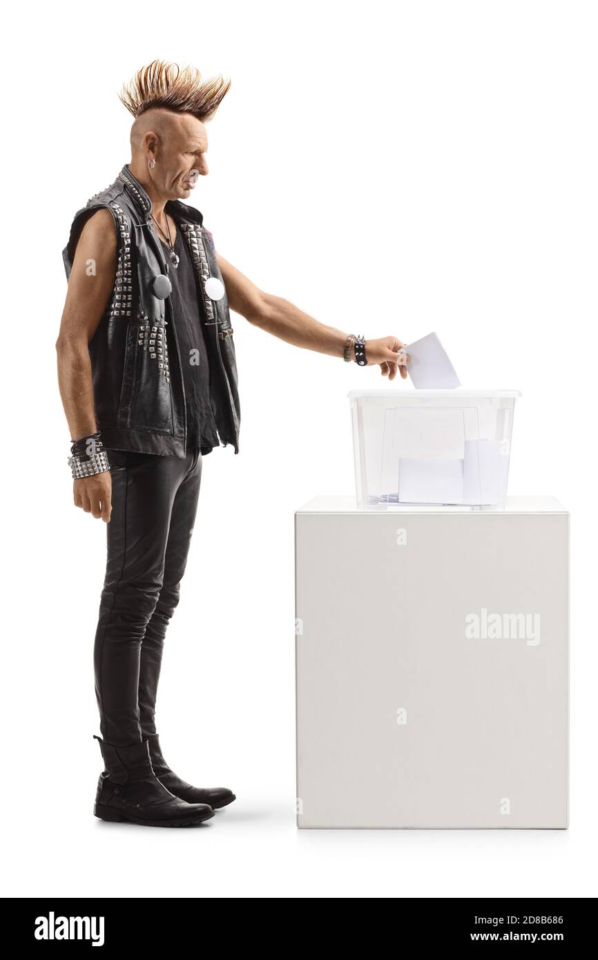 Full length profile shot of a punk with a mohawk putting a vote in an ...