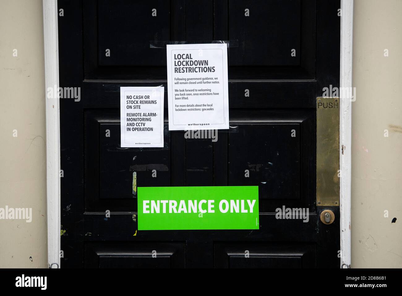 BRIDGEND, WALES - OCTOBER 28: A close-up of a sign on the door of a ...