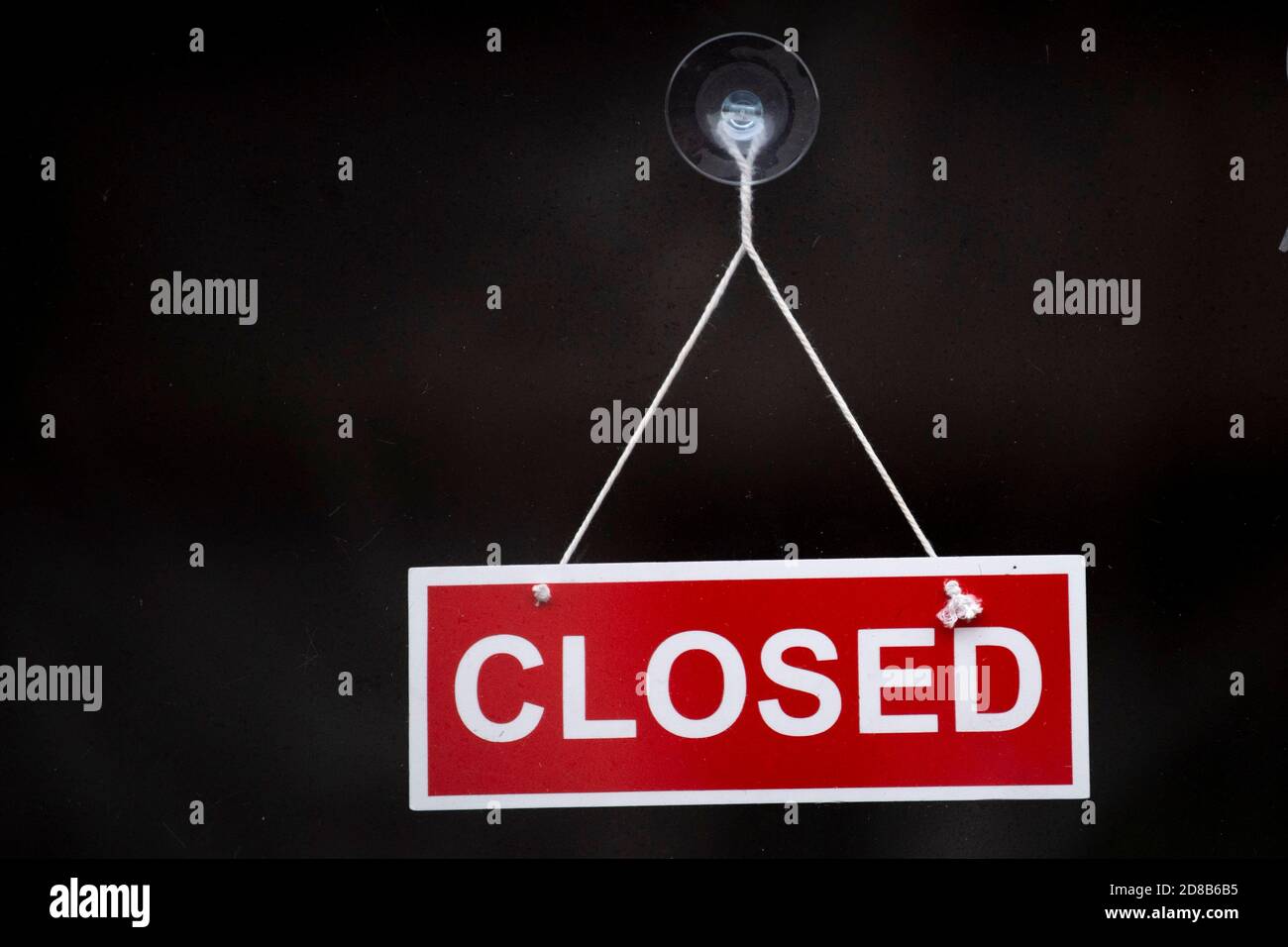 BRIDGEND, WALES - OCTOBER 28: A close-up of a closed sign hanging on ...