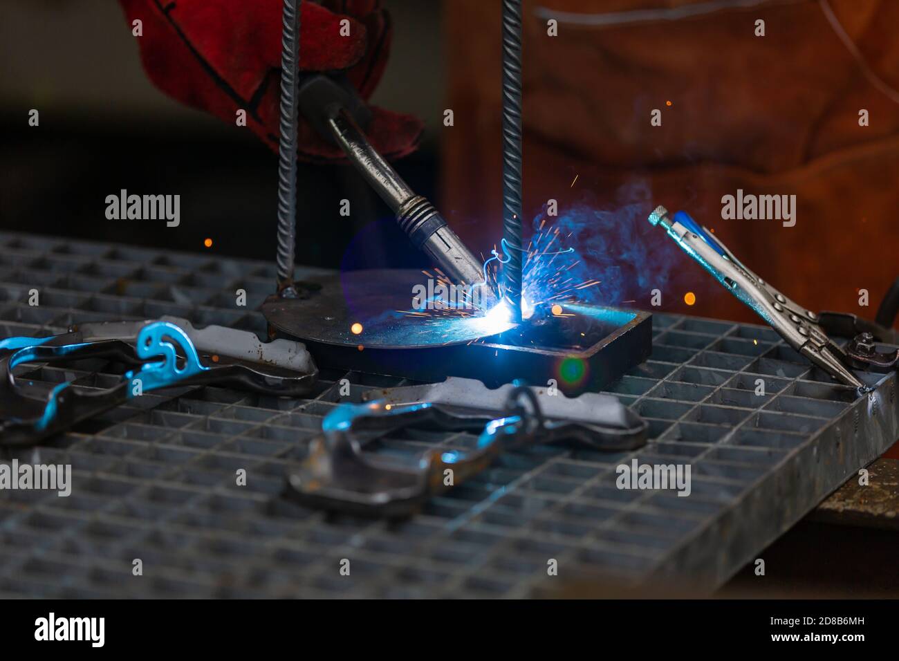 Details of welding activities - a welder is welding steel components ...