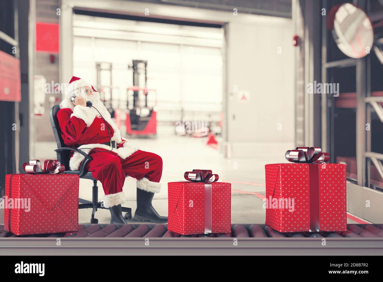 Santa Claus busy with the orders of Christmas gifts in a warehouse ...