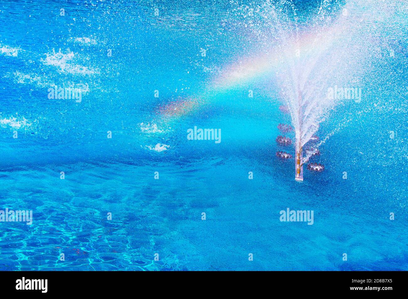 A water fountain sprinkling water in the view Stock Photo - Alamy