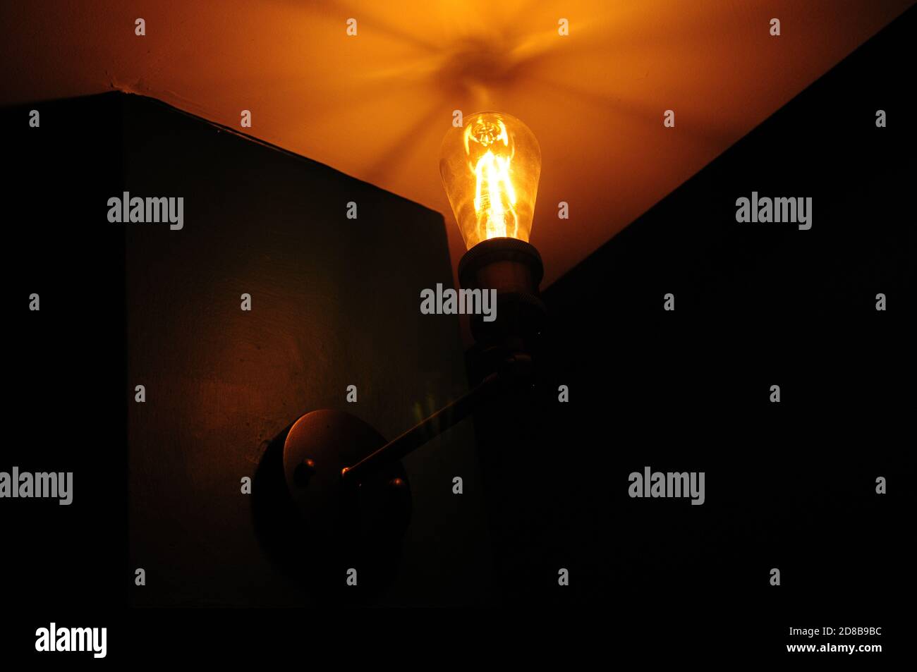 Corner of room with illuminated light reflection on roof Stock Photo ...