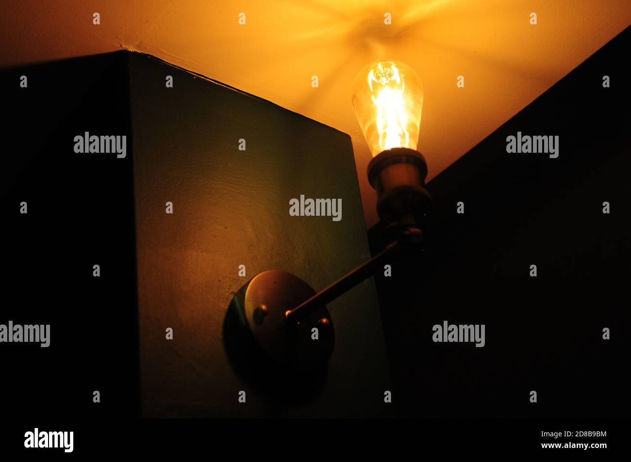 Corner of room with illuminated light reflection on roof Stock Photo ...