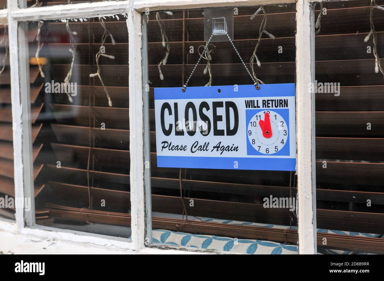 york, UK, england, 25-10-2020, Retail shop door with hanging plague ...