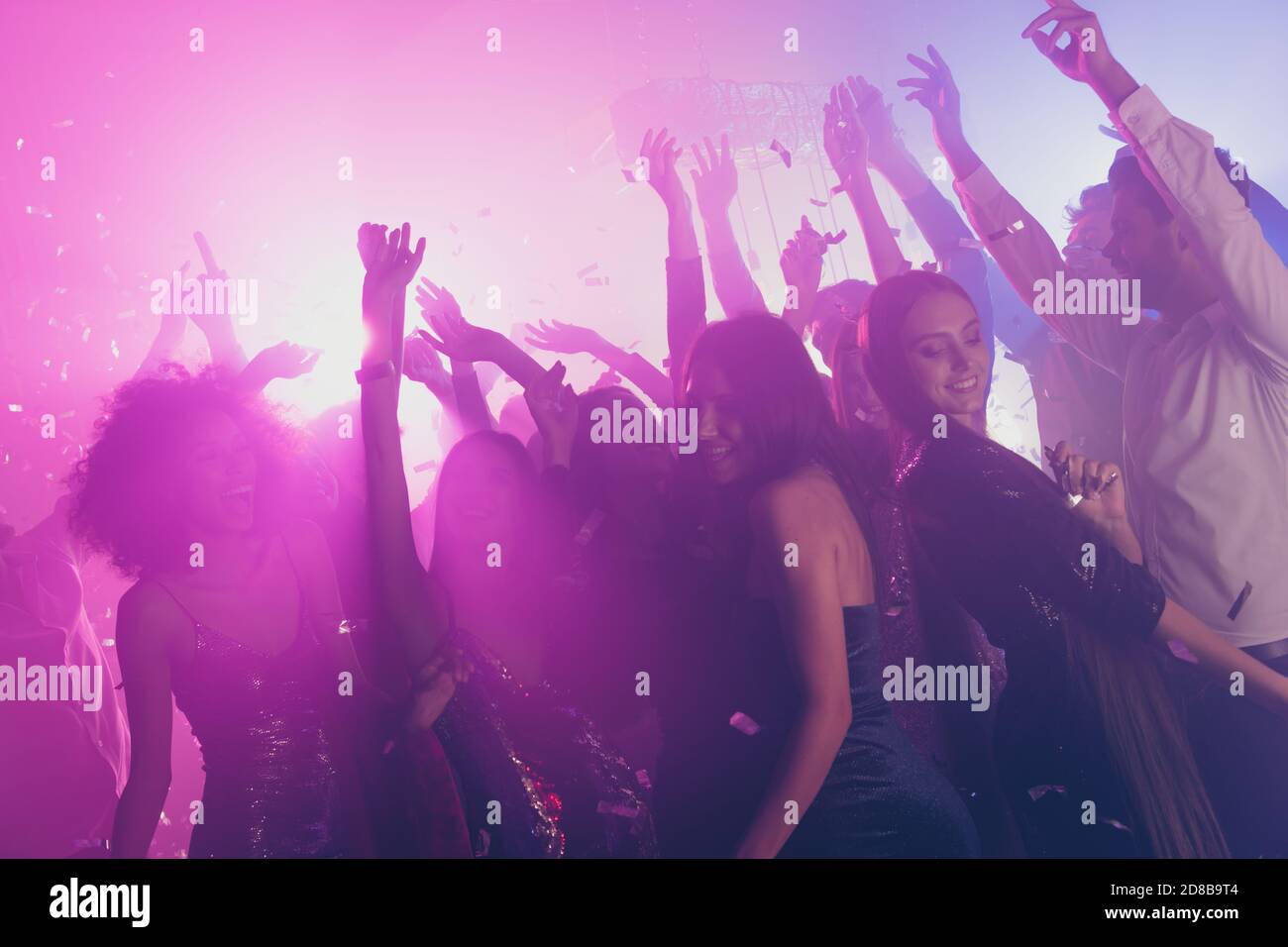 Photo of big group many fancy ladies dance have fun raise arms neon ...