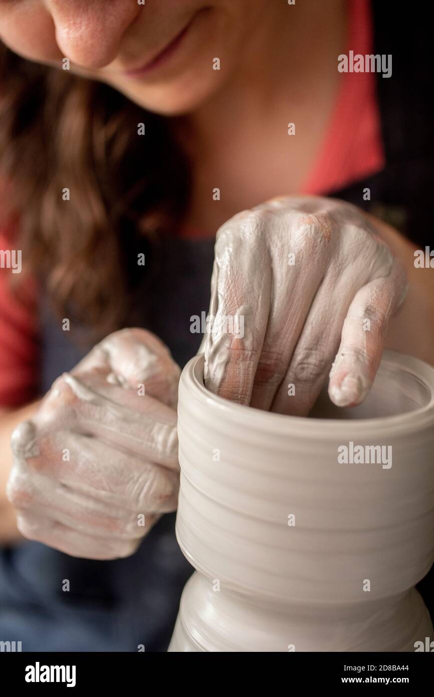 Close up of hands working on ceramics Stock Photo - Alamy