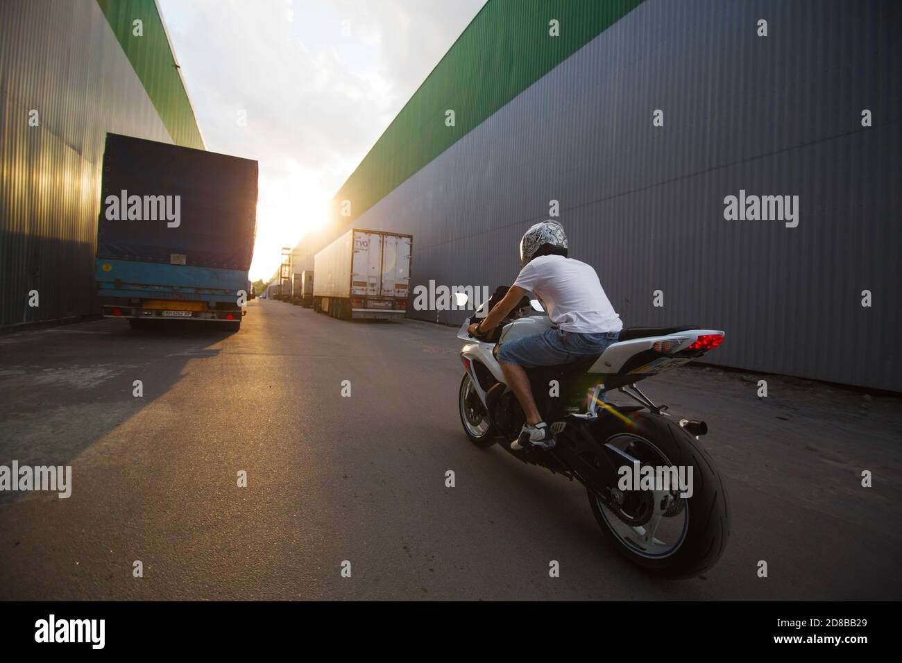 A young guy and a powerful sports bike. Photo on the street Stock Photo ...