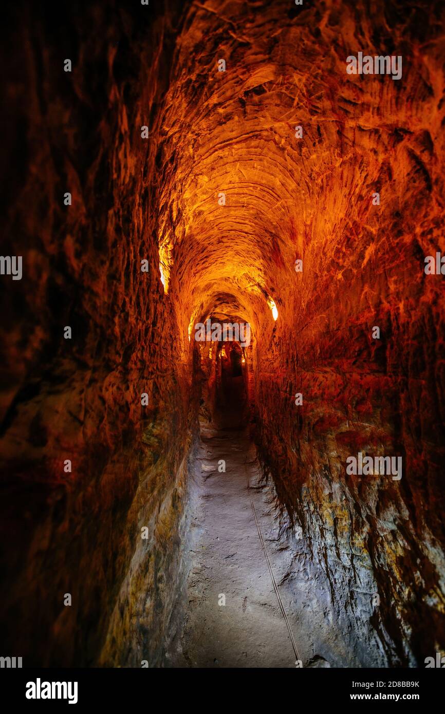 Ancient narrow underground passage in sandstone at old underground ...