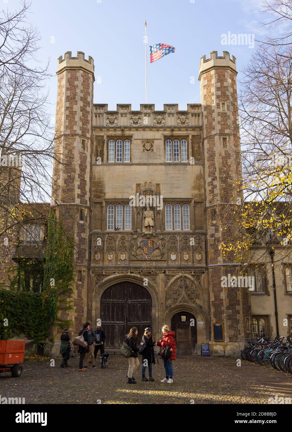 The main entrance of Trinity College Chapel with students standing ...