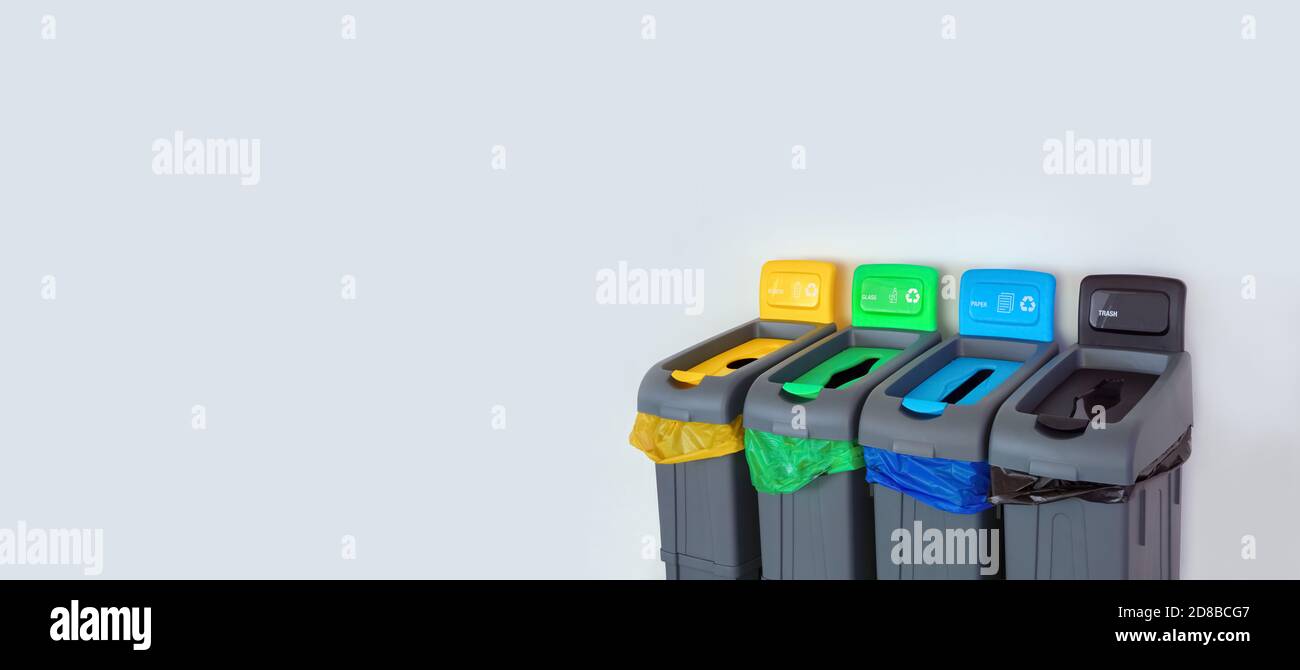 Different colored bins for collection of recycled materials. Green ...