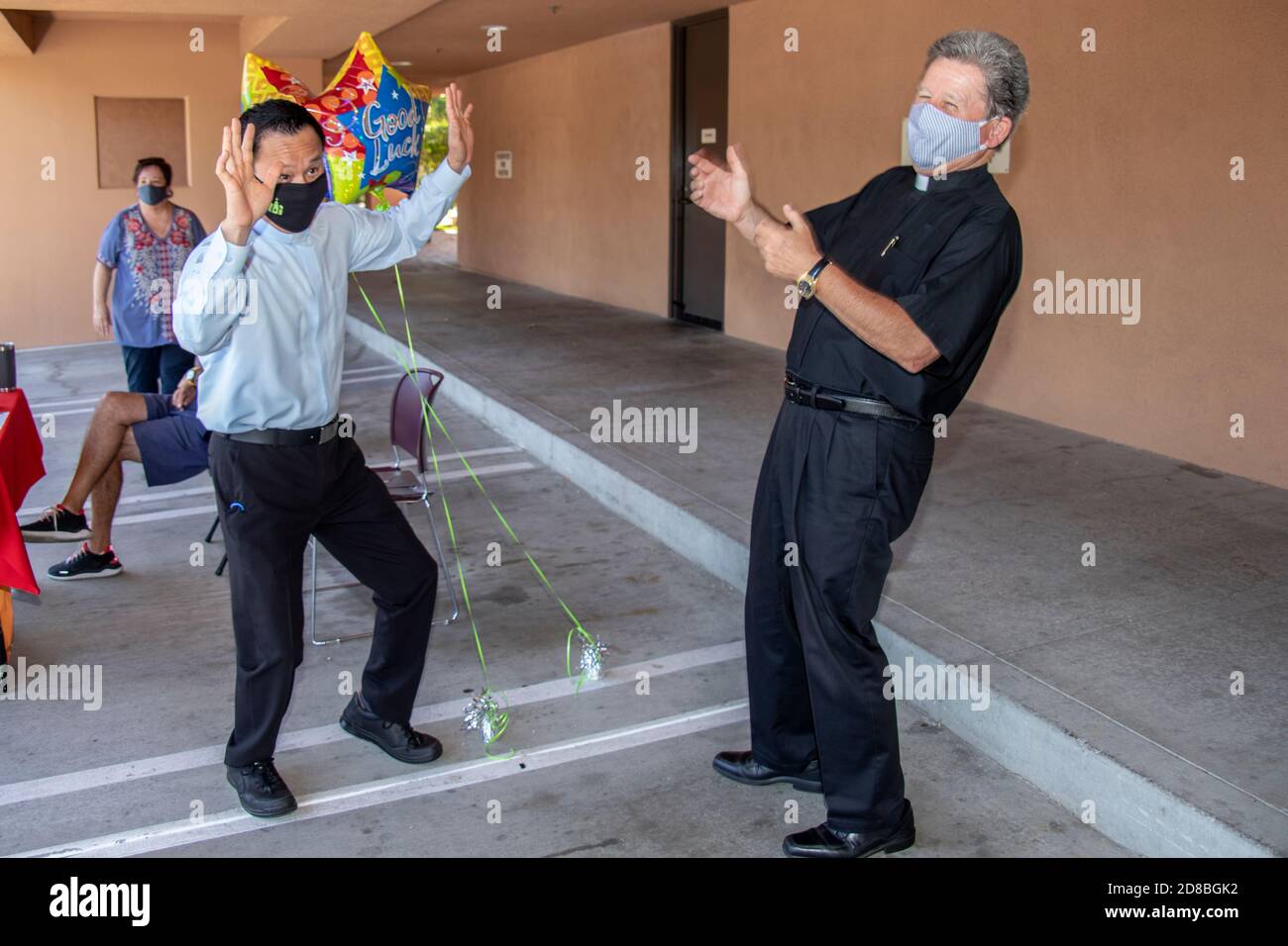 A departing Asian American priest does a celebratory dance as his ...