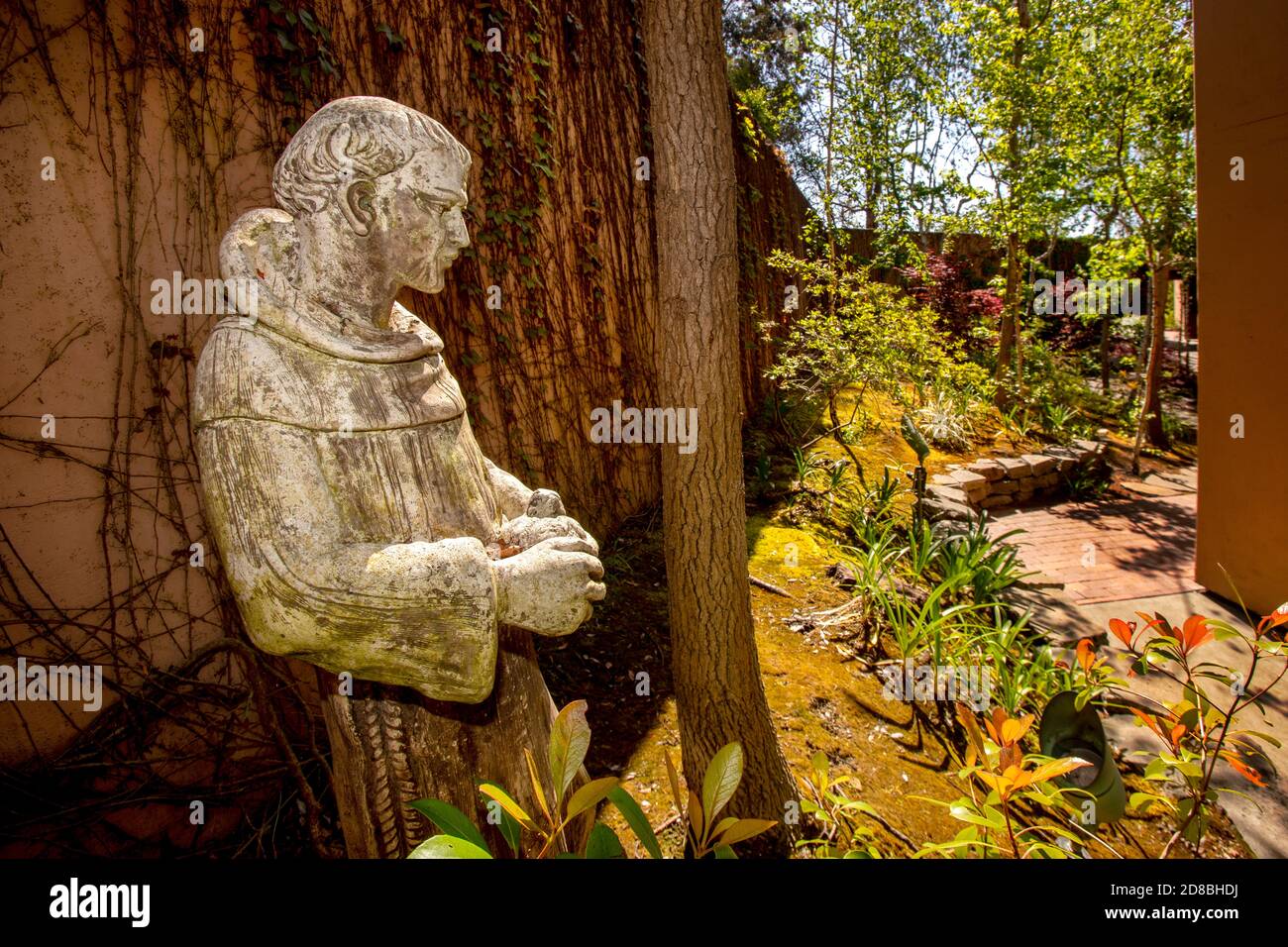 A peaceful garden with a statue of Saint Timothy is part of a ...