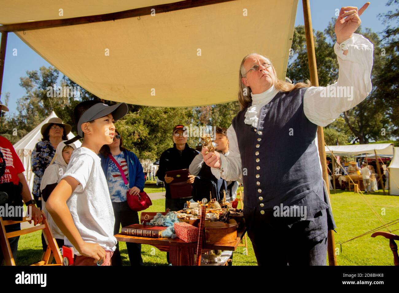 Dressed as Benjamin Franklin, an actor points out a spot in the ...
