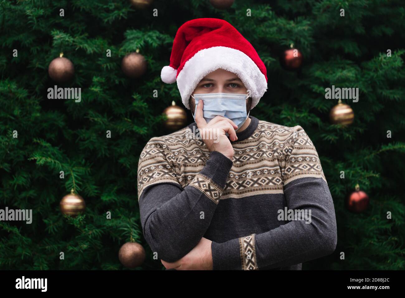 Christmas idea. Close up Portrait of man wearing a santa claus hat ...