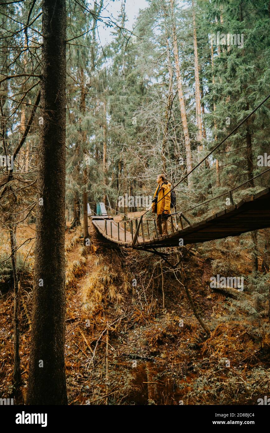 Man walking suspension bridge hi-res stock photography and images - Alamy