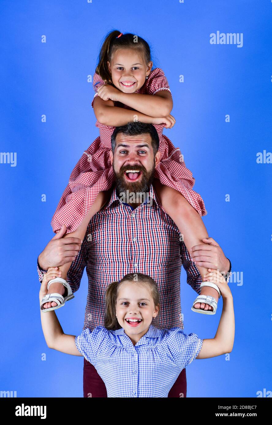 Father and his daughters. Two daughters with their beloved dad. having ...