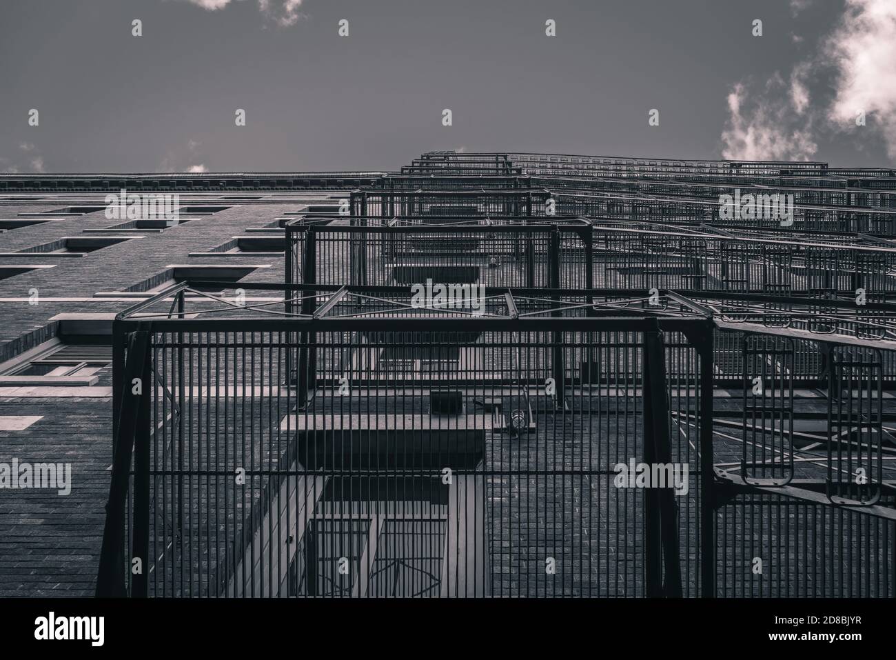 Low angle shot of fire exit stairs on a building in grayscale Stock ...