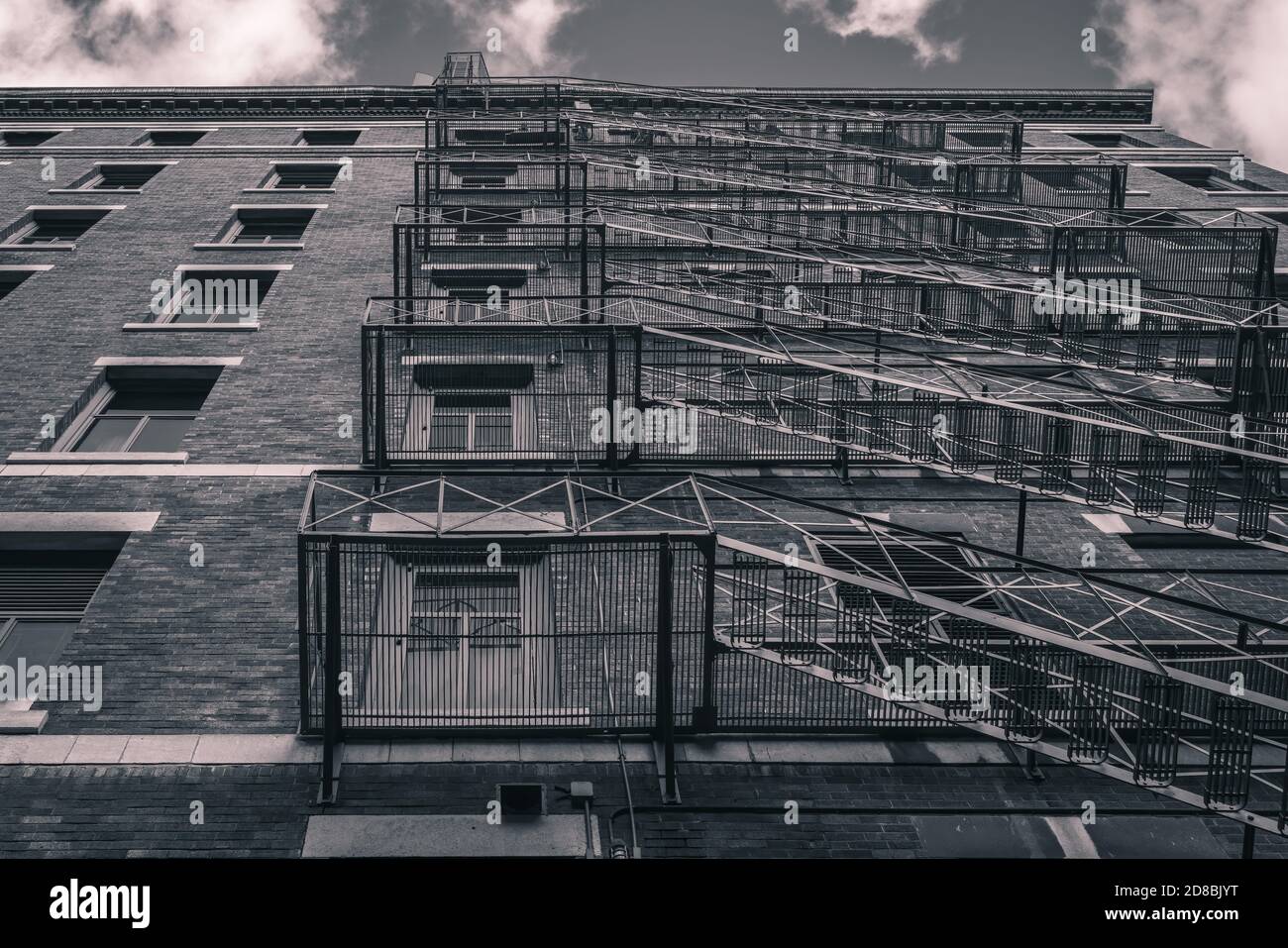 Low angle shot of fire exit stairs on a building in grayscale Stock ...