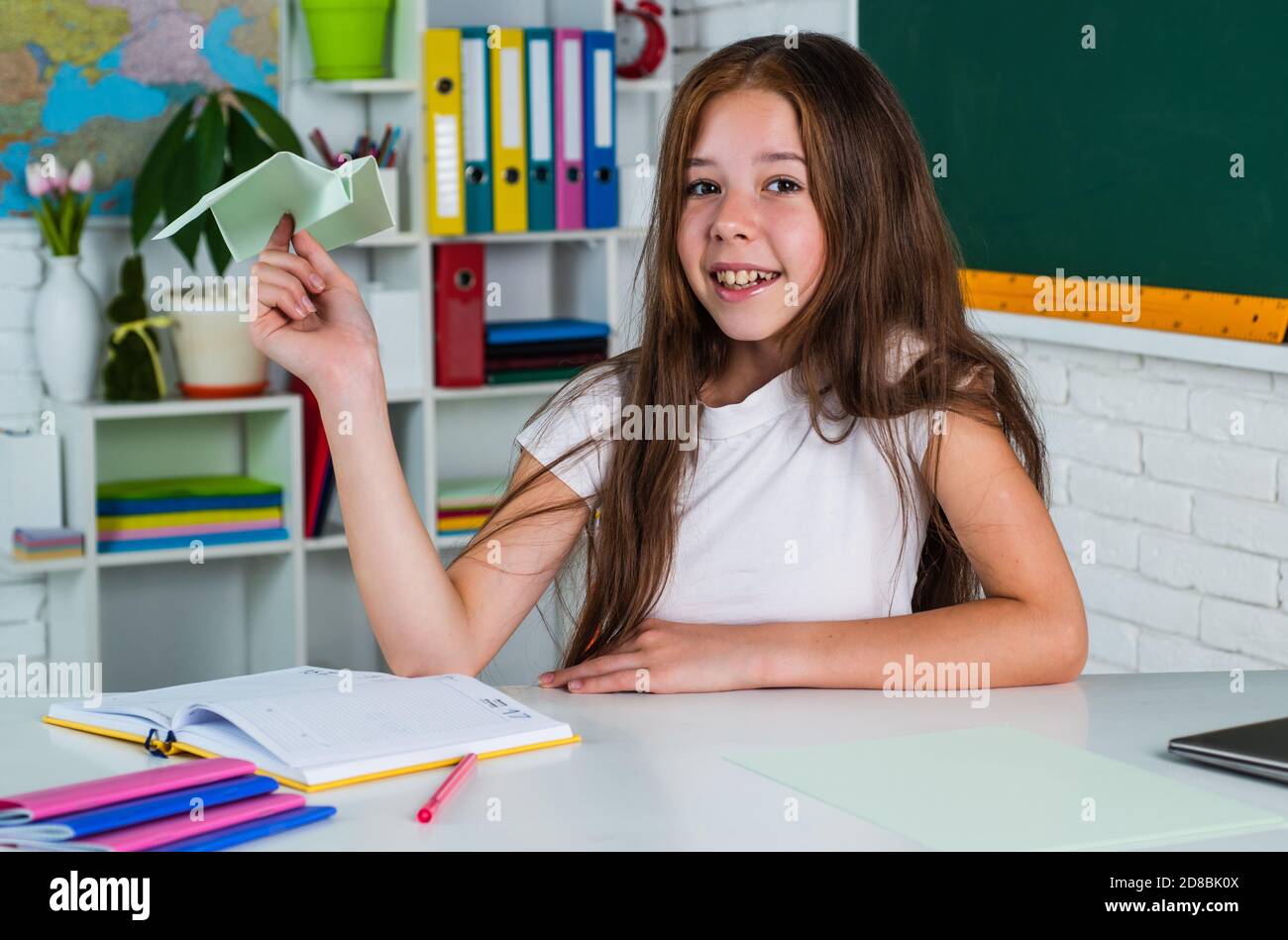 happy child in classroom school with blackboard, education Stock Photo ...
