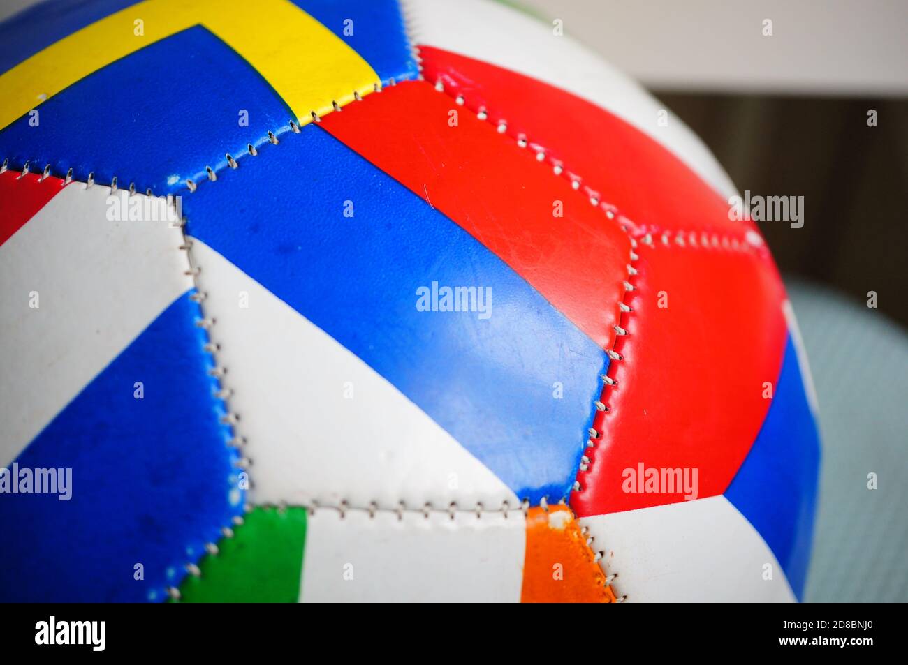 Closeup of a colorful ball with different country flags printed on it ...