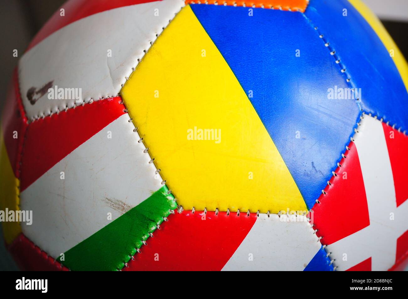 Closeup of a colorful ball with different country flags printed on it ...