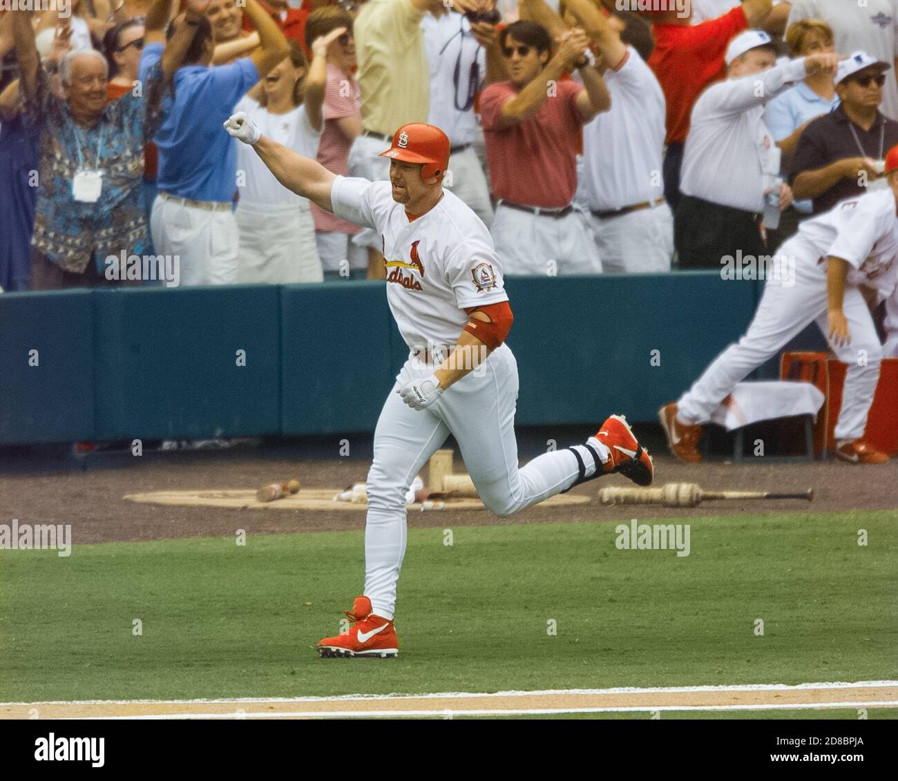 St. Louis slugger Mark McGwire pumps his fist after hitting his 61st ...