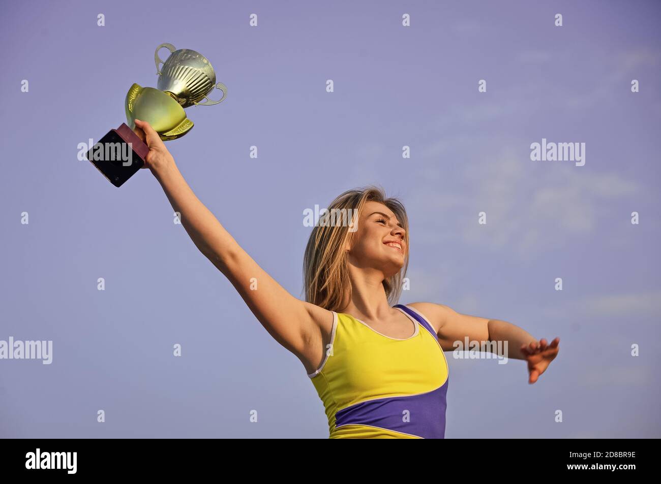 Conception of victory in the competition. happy woman with gold ...