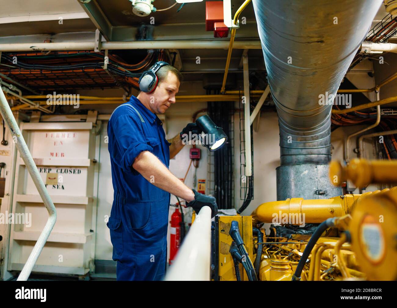 Marine engineer officer controlling vessel enginesand propulsion in ...