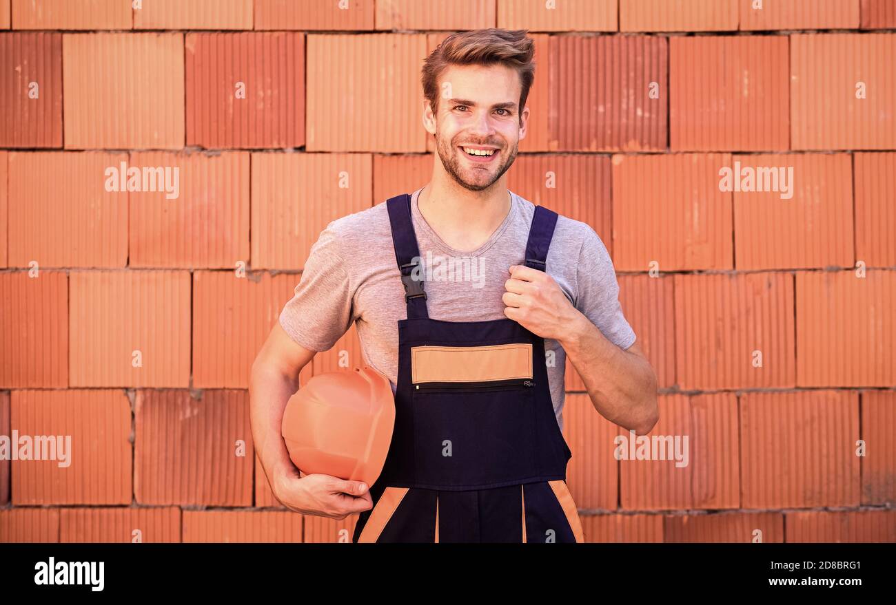 Building construction. Man build house. Inspecting building. Worker ...