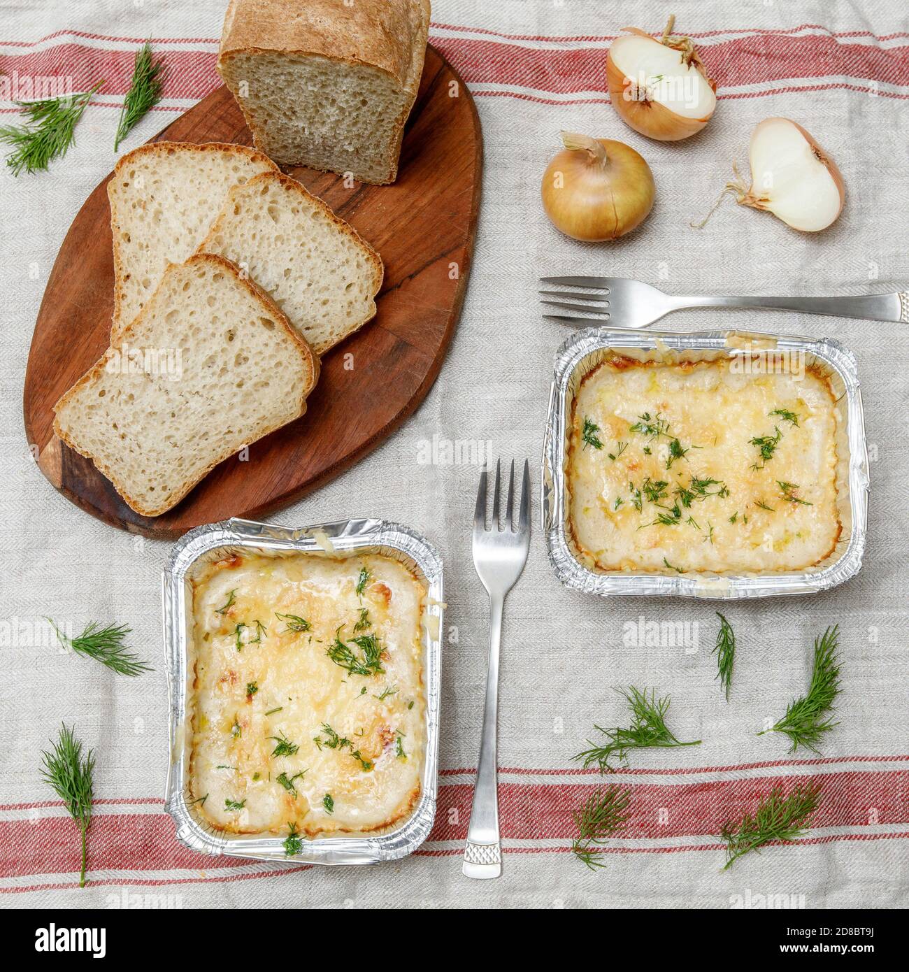 Cheese julienne with baked mushrooms served with bread Stock Photo - Alamy