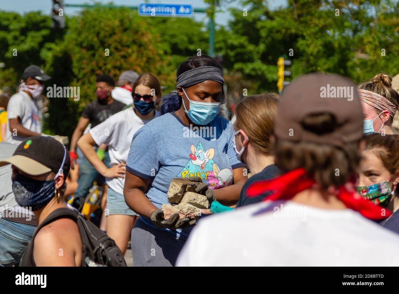 Minneapolis, MN - May 31, 2020: Volunteers cleaning up the rubble and ...