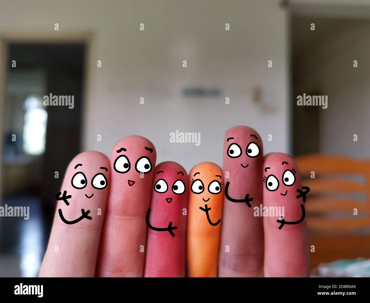 Six fingers are decorated as six person. They are having gathering at ...