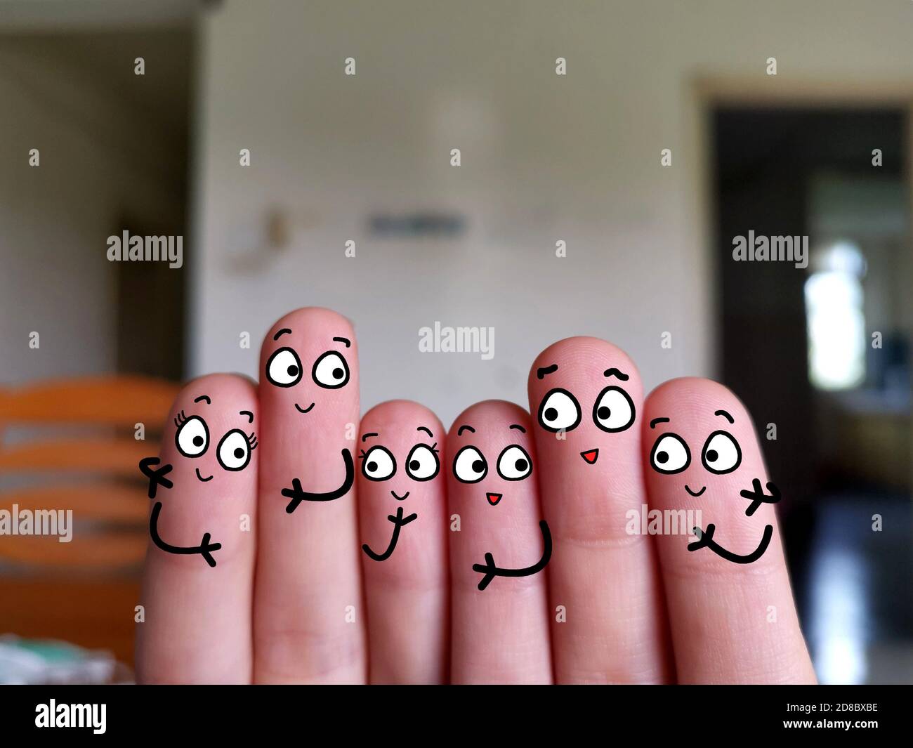 Six fingers are decorated as six person. They are having gathering at ...