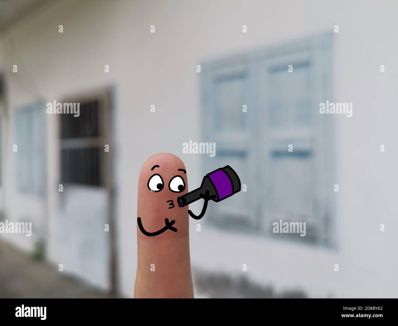 One finger is decorated as one person. He is drinking alcohol Stock ...