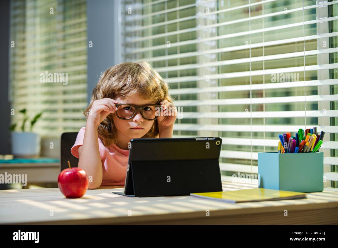 Back to school. First day at school. Cute little boy child using laptop ...