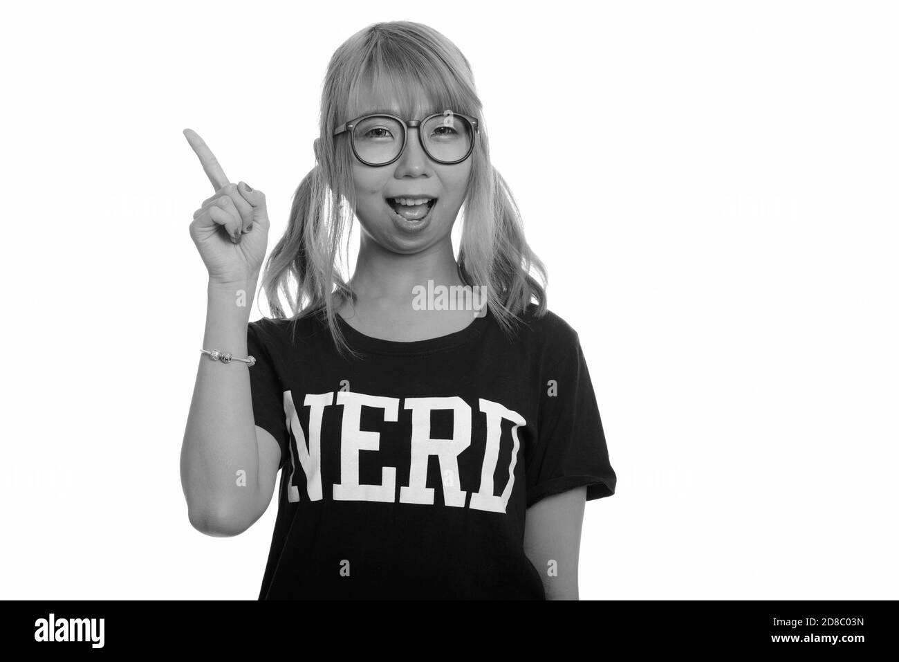 Young happy Asian nerd woman smiling and pointing finger up Stock Photo ...